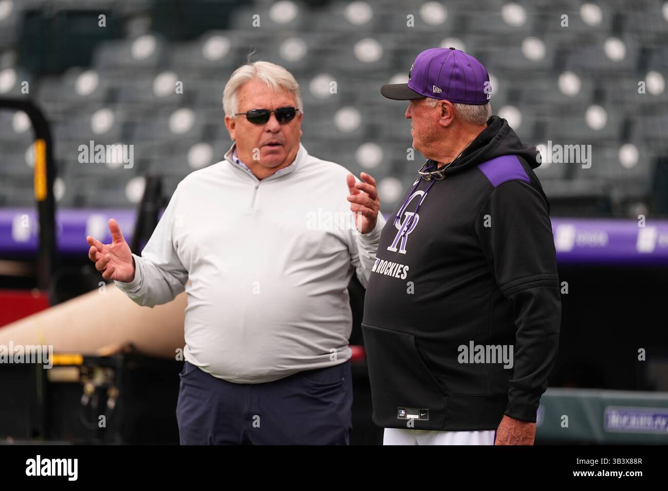 Colorado Rockies general manager Bill Schmidt confers with bating ...