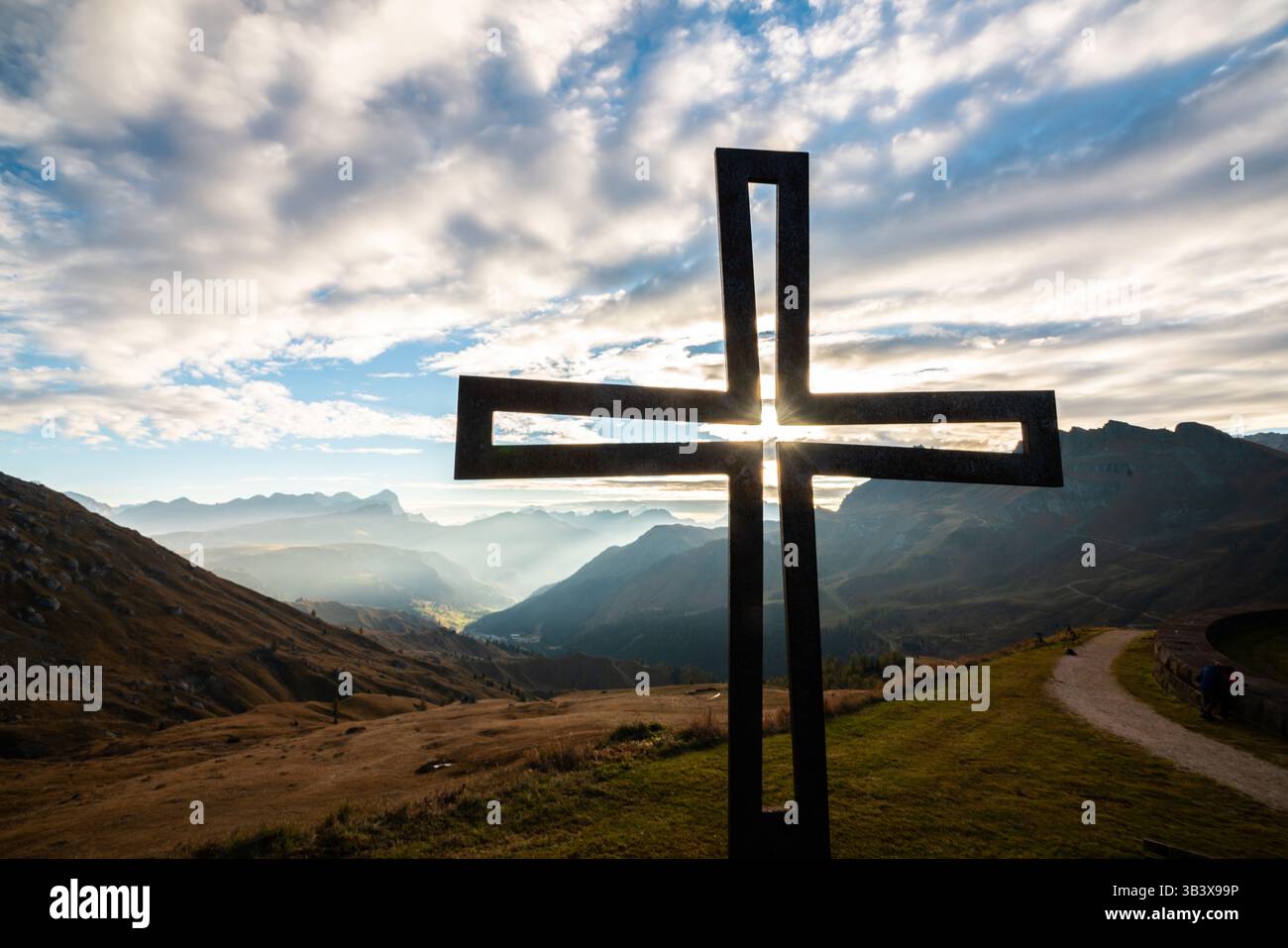 Sunset Through the Cross in the Italian Alps Stock Photo - Alamy
