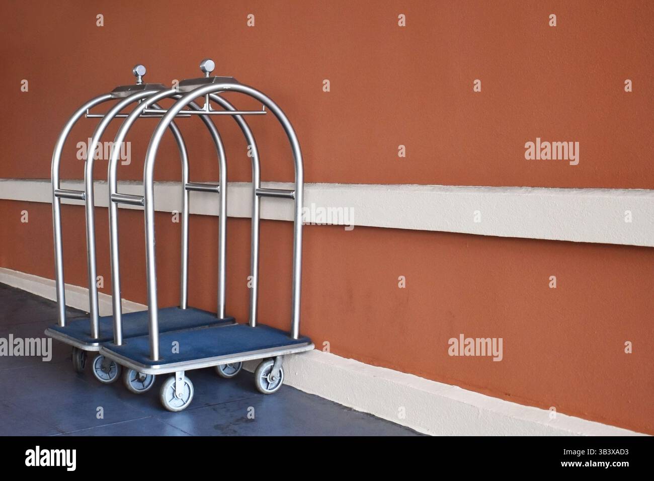 Retro luggage carts near the hotel entrance, Metal luggage trolley in ...