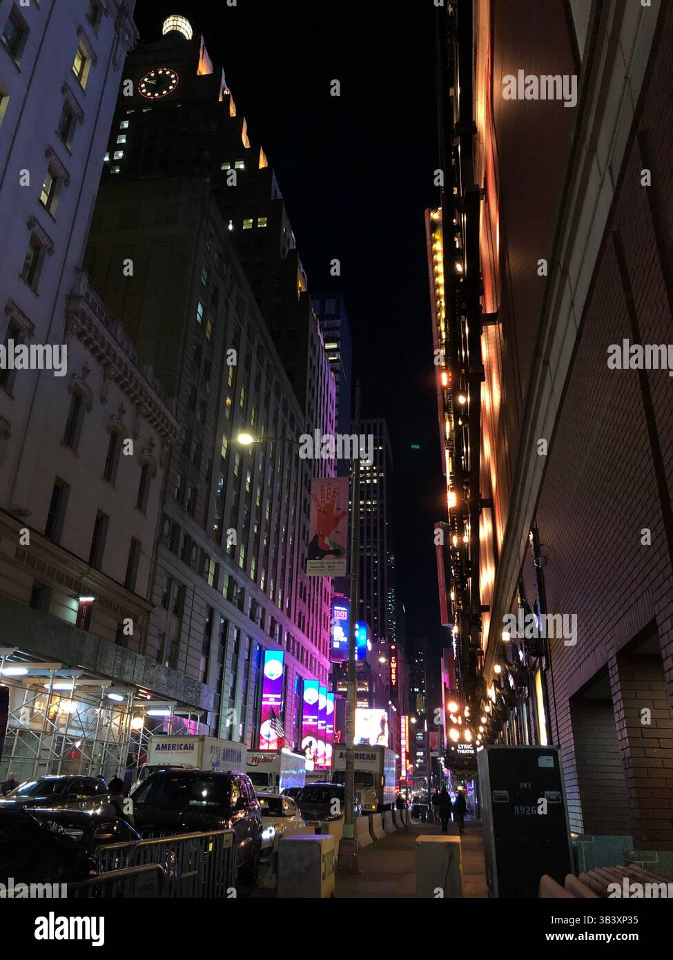 NYC Times Square at night full of neon lights, theater signs ...