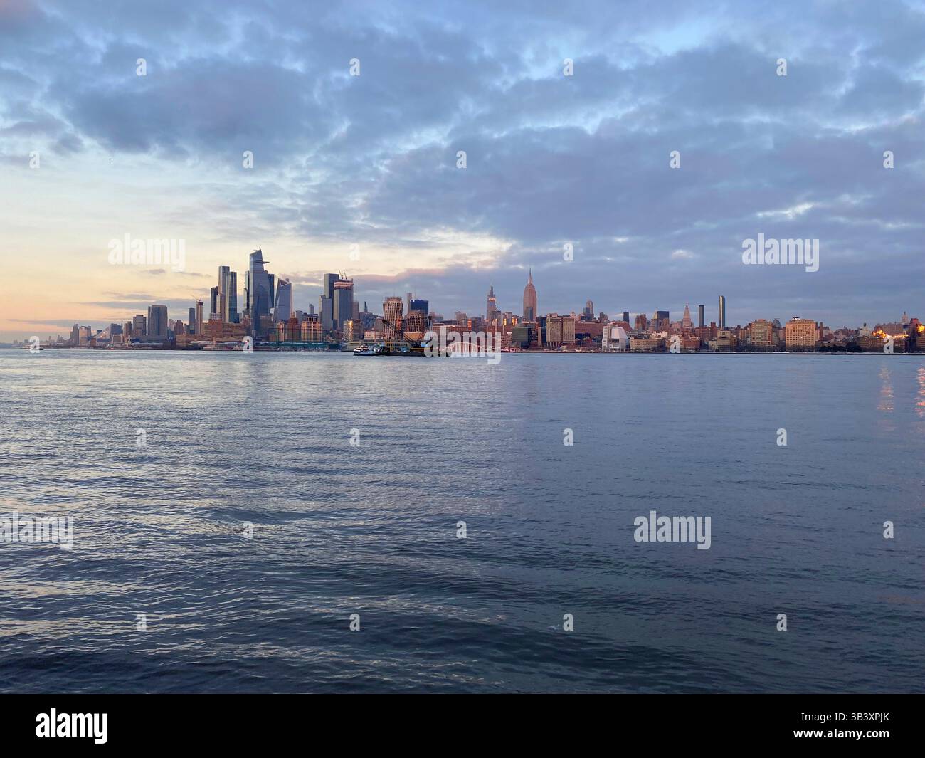 NYC buildings skyline across water with modern towers Stock Photo - Alamy