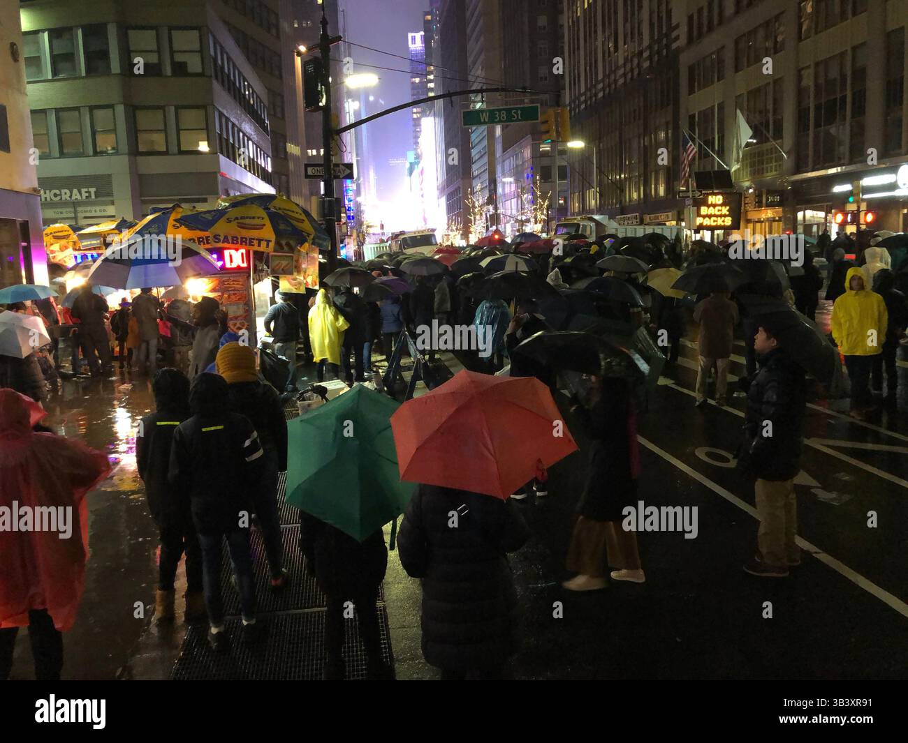 Times Square at night in NYC showing digital signs, crowded sidewalks ...