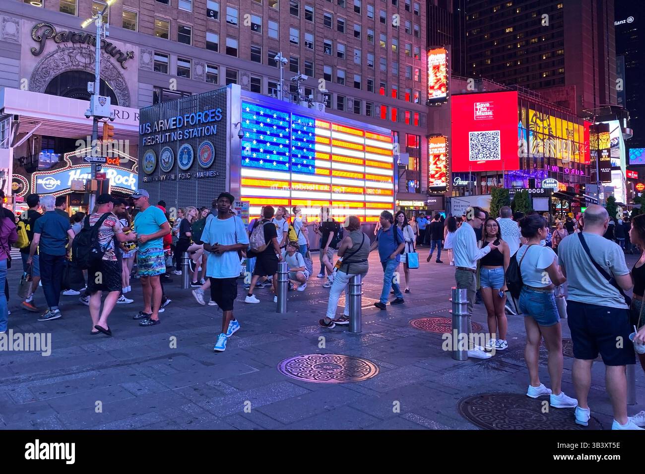 NYC Times Square with large digital signs, crowded walkways, taxis and ...