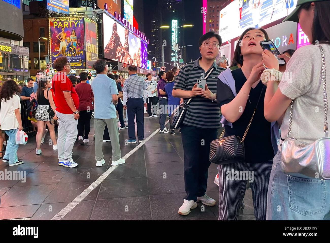 Times Square scene in New York with high rise billboards, LED glow ...