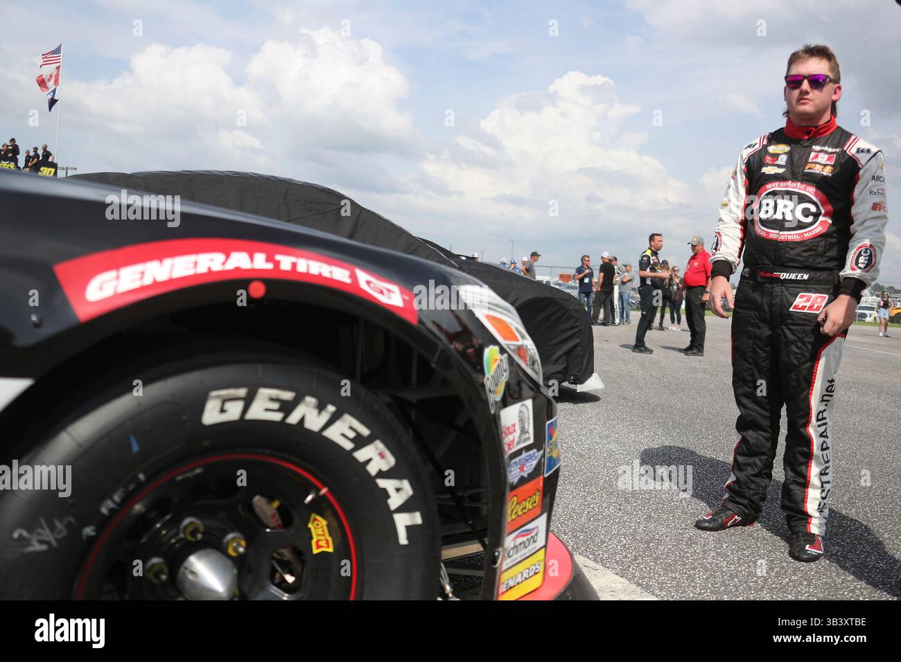 TALLADEGA, AL - APRIL 25: Brenden Queen (#28 Best Repair Chevrolet) talks with members of his ...