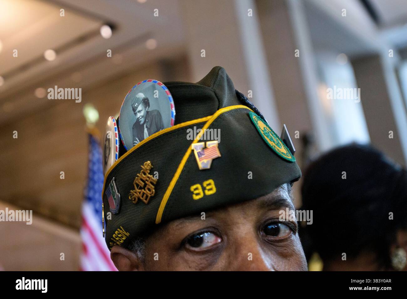 Retired Army Master Sgt. Elizabeth Anne Helm-Frazier, wears pins of ...