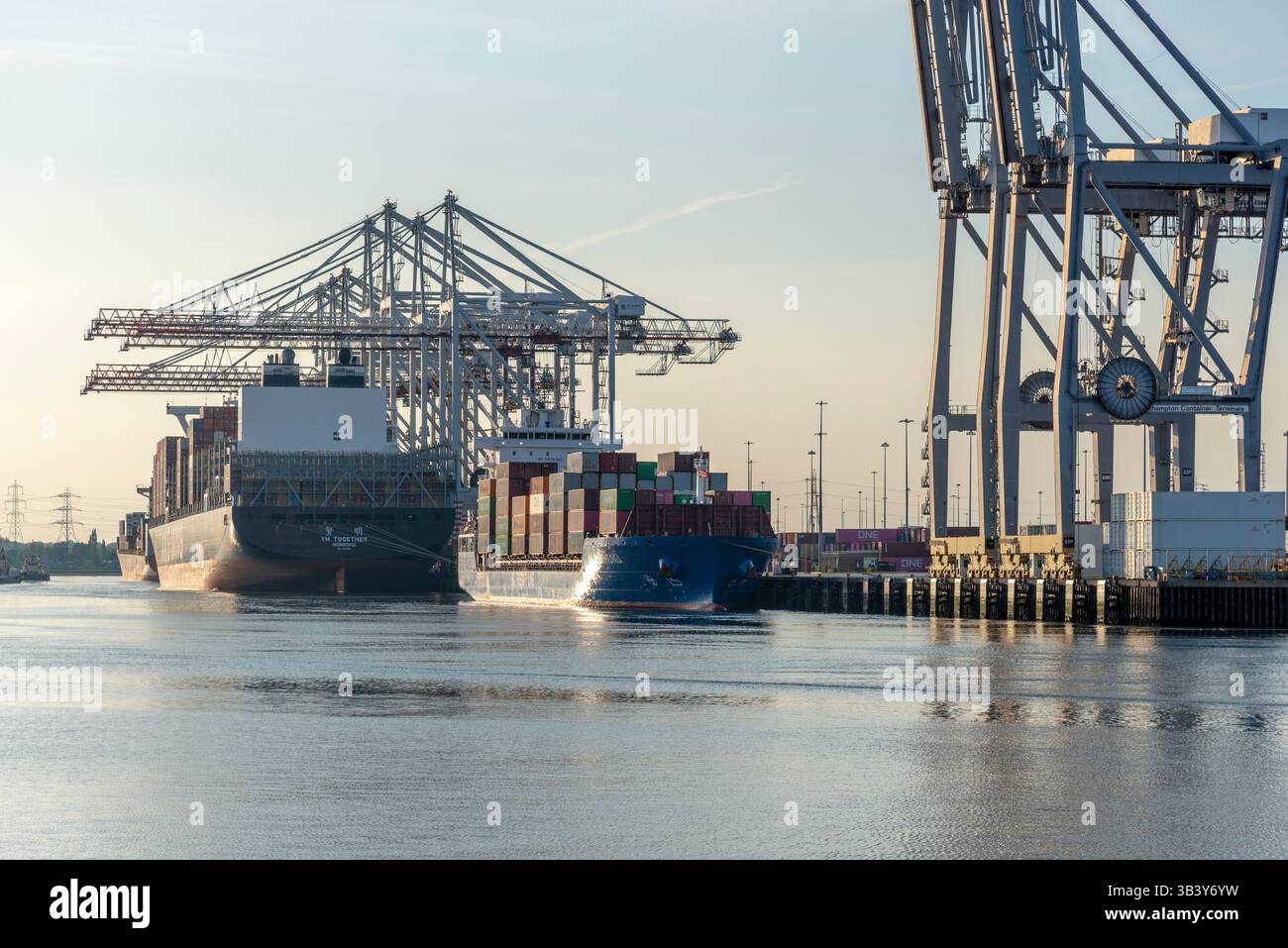 Southampton England UK. 28.04.2025. Container ships and quay cranes ...