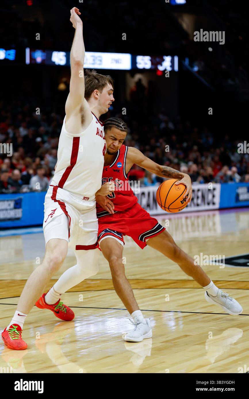 March 23, 2025: Alabama forward Grant Nelson (4) defends against St. Mary's guard Mikey Lewis (0 ...