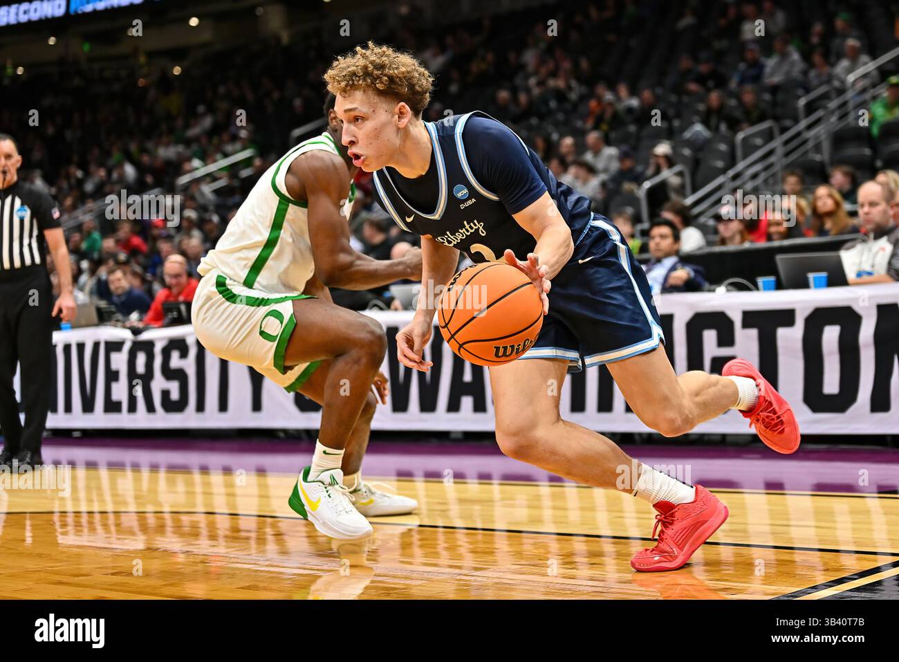 Seattle, WA, USA. 21st Mar, 2025. Liberty Flames guard Taelon Peter (2 ...