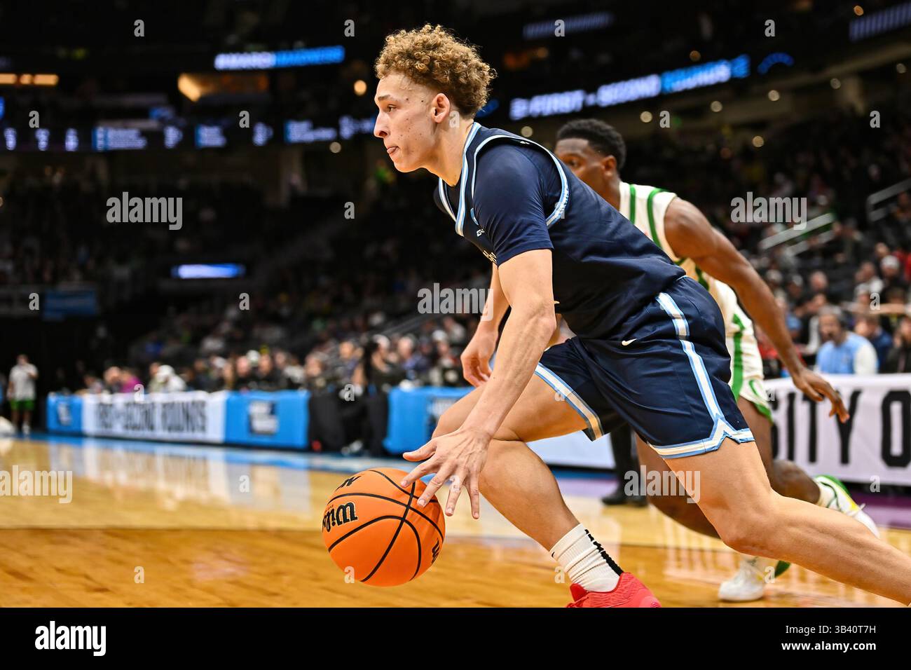 Seattle, WA, USA. 21st Mar, 2025. Liberty Flames guard Taelon Peter (2 ...