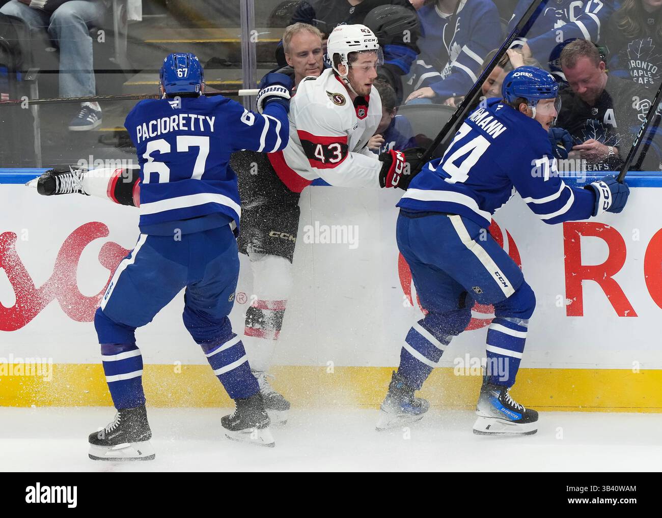 Toronto Maple Leafs' Max Pacioretty (67) hits Ottawa Senators' Tyler ...