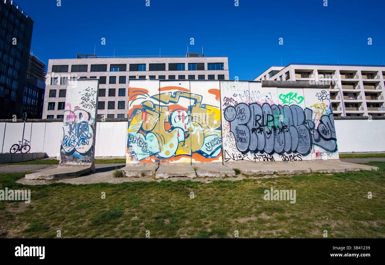 Remains of the Former Berlin Wall with Graffiti in Front of Freshly ...