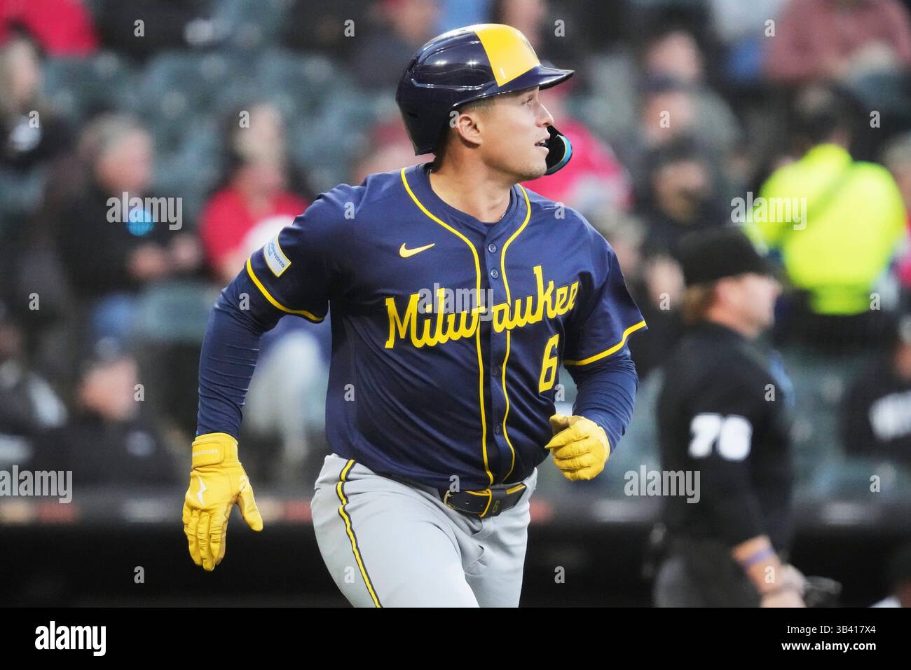 Milwaukee Brewers' Isaac Collins rounds the bases after hitting a solo ...