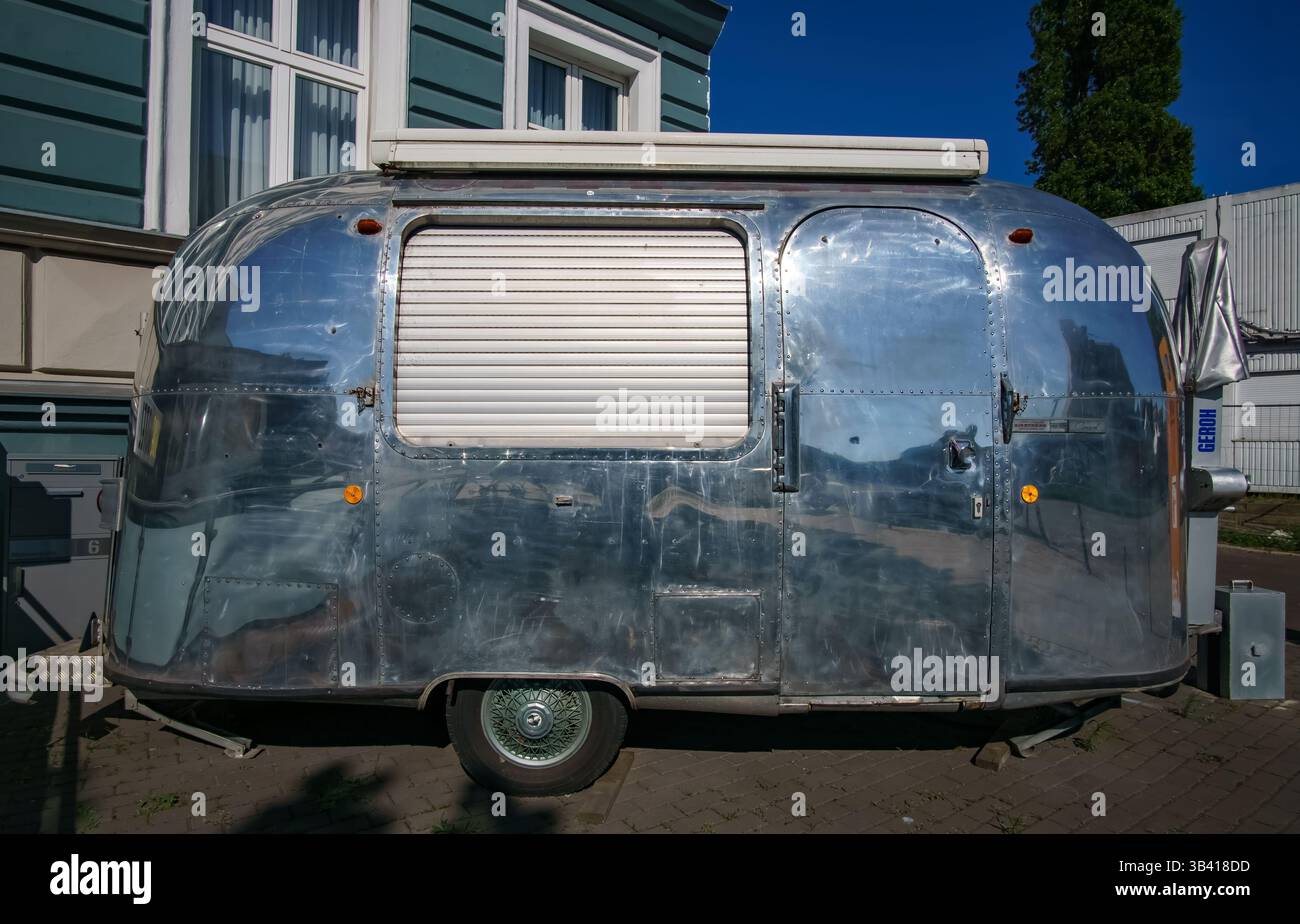 Shiny Chrome Luxury Airstream Caravel Vintage Trailer Parked in Urban ...