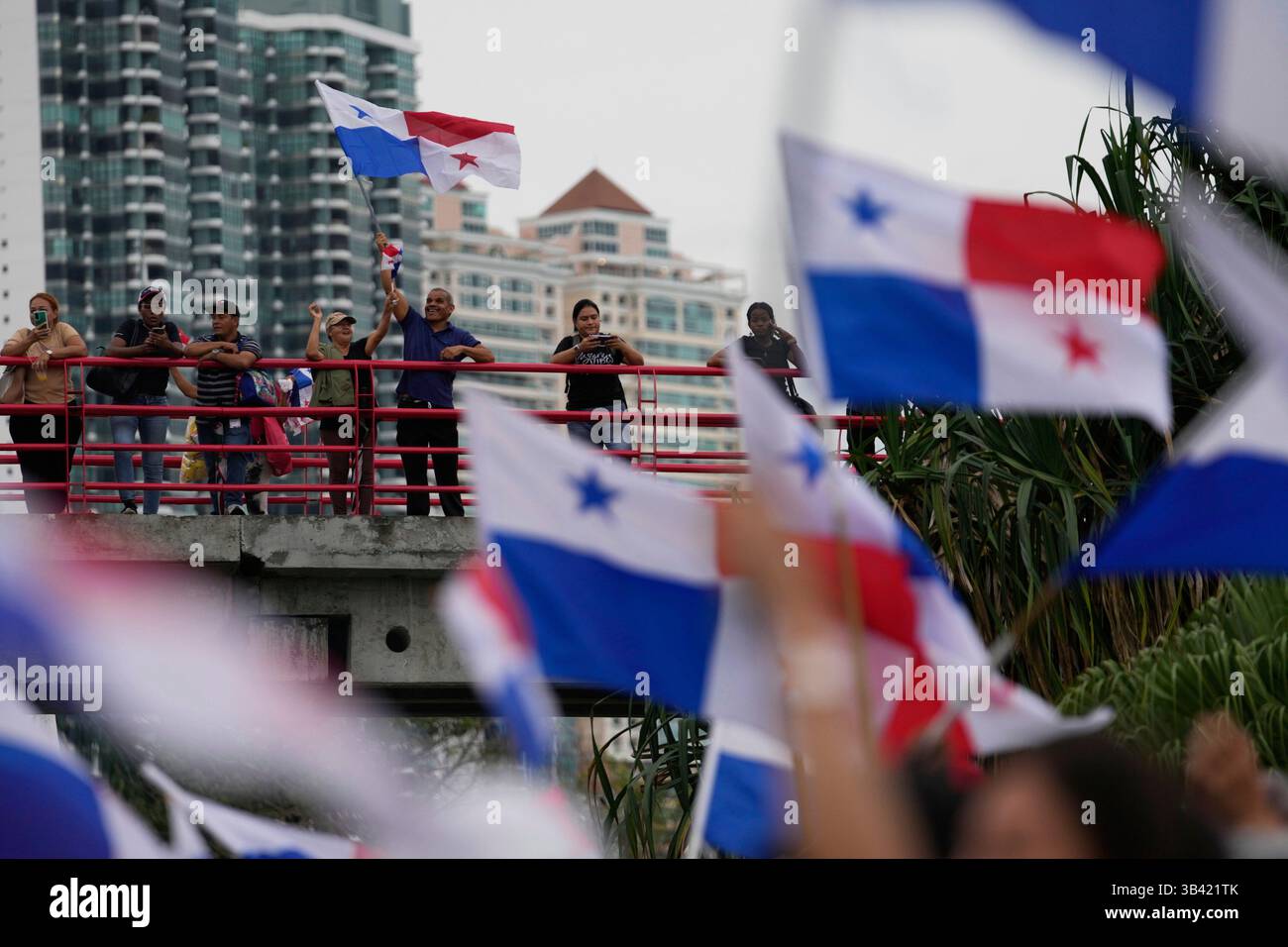 People protest the Panamanian government's decision to sign an ...