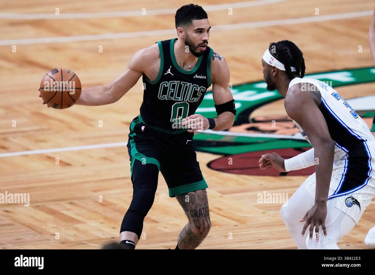 Boston Celtics forward Jayson Tatum (0) drives to the basket against ...