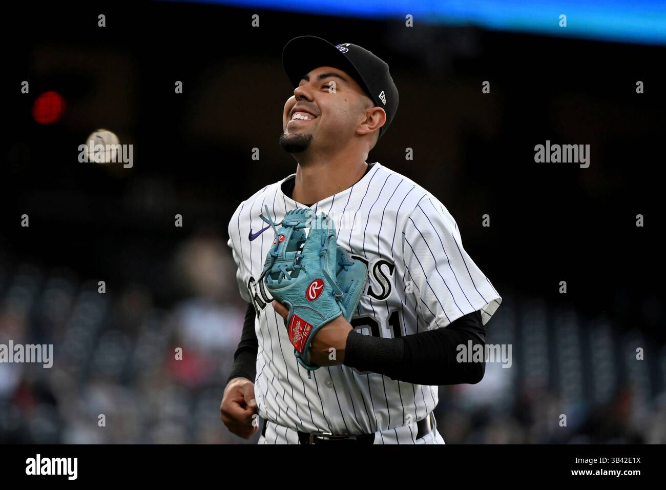 Colorado Rockies shortstop Alan Trejo (31) smiles after fielding three ...