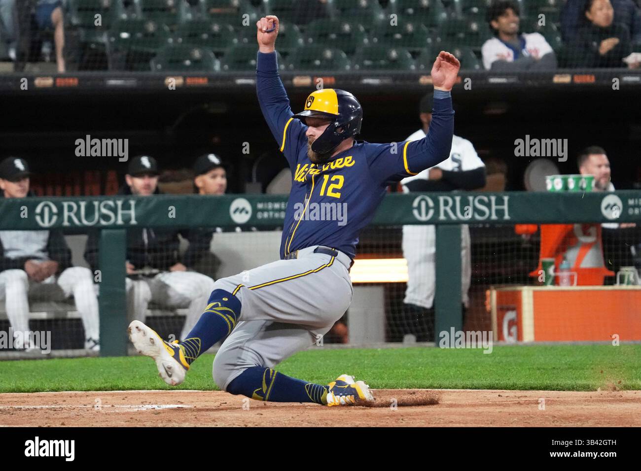 Milwaukee Brewers' Rhys Hoskins scores on a two-run single by Caleb ...