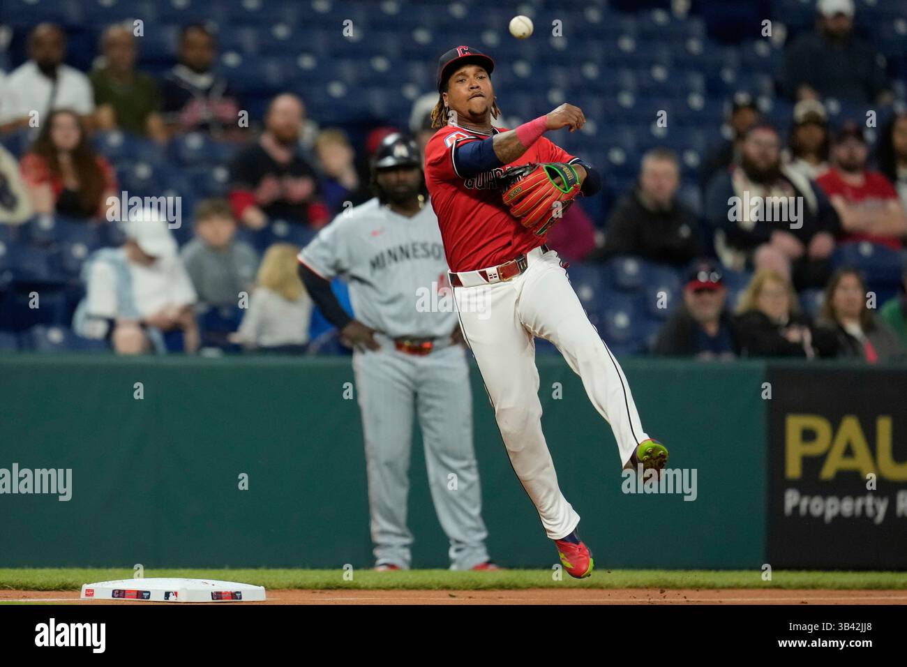 Cleveland Guardians third baseman Jose Ramirez (11) throws out ...
