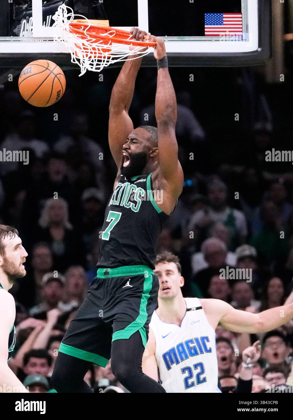 Boston Celtics guard Jaylen Brown (7) dunks against the Orlando Magic ...