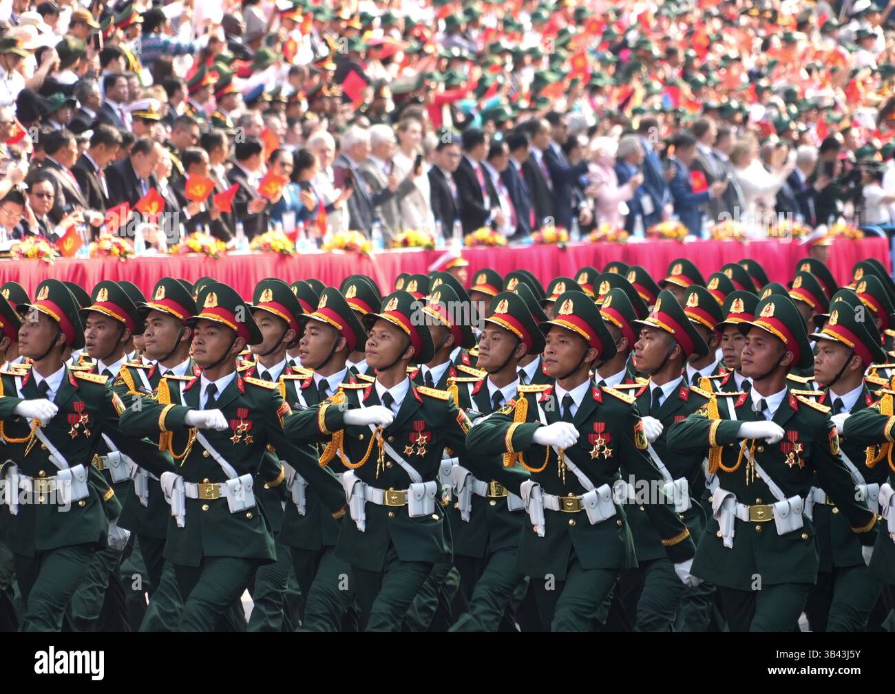 Vietnamese troops march during a parade to commemorate the 50th ...