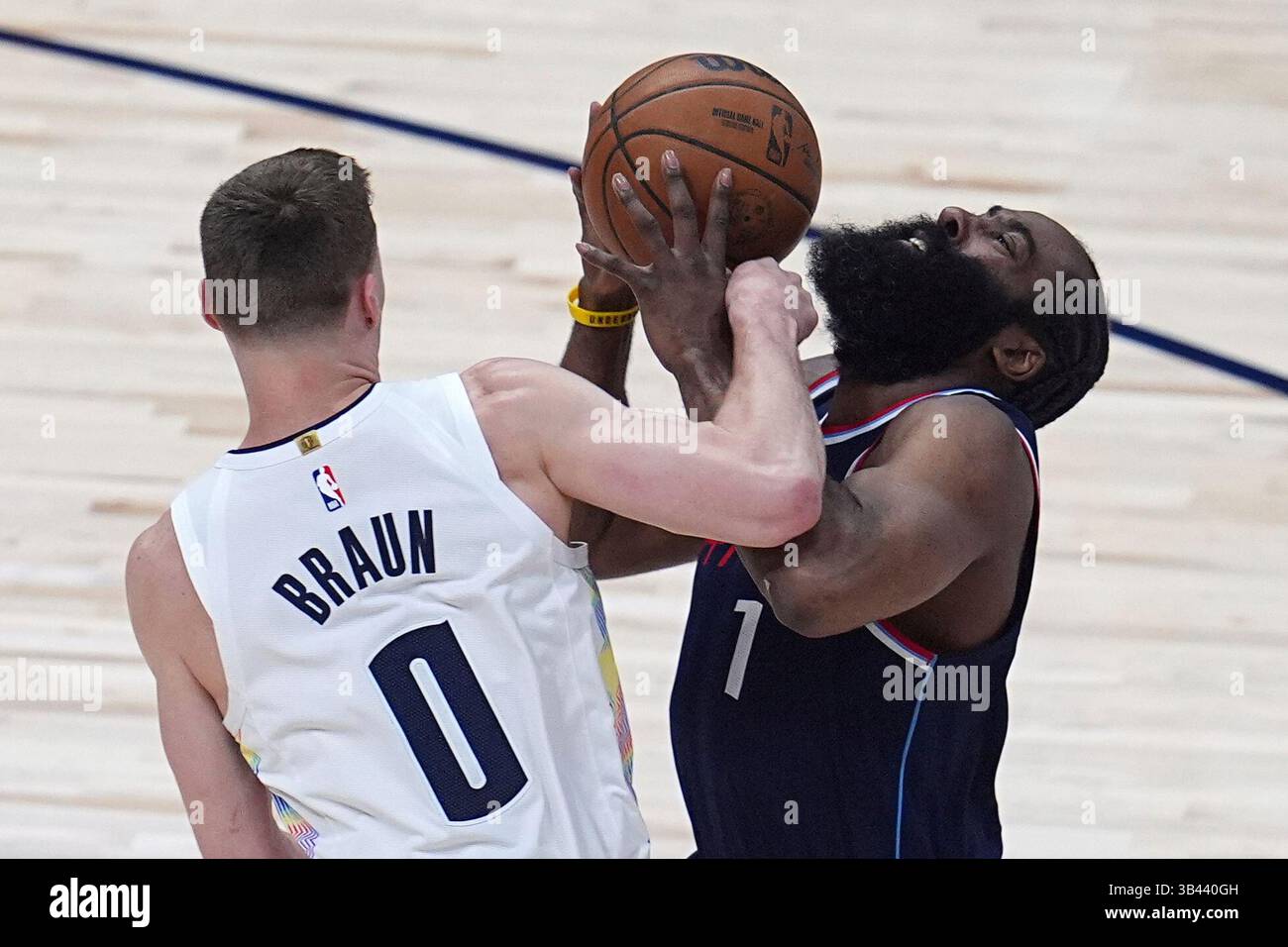 Denver Nuggets guard Christian Braun, left, fouls Los Angeles Clippers ...