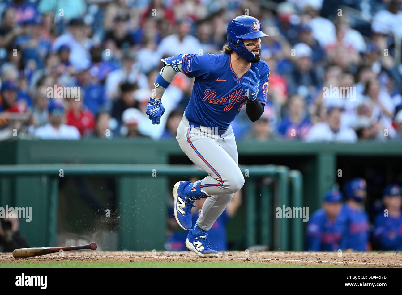 New York Mets' Jesse Winker runs after hitting a single against ...