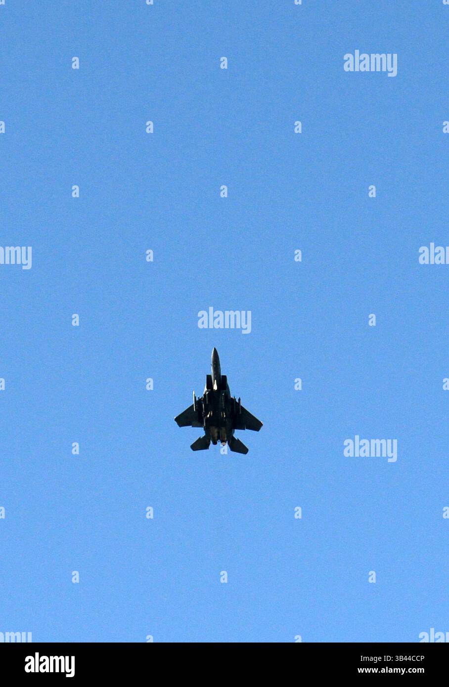 An American F-15 Eagle fighter Jet flying over Chatan, Okinawa, Japan ...