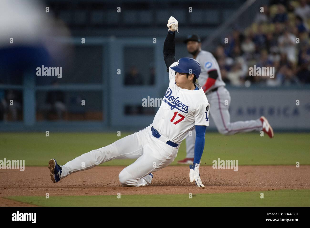 Los Angeles Dodgers' Shohei Ohtani slides to steal second base during ...