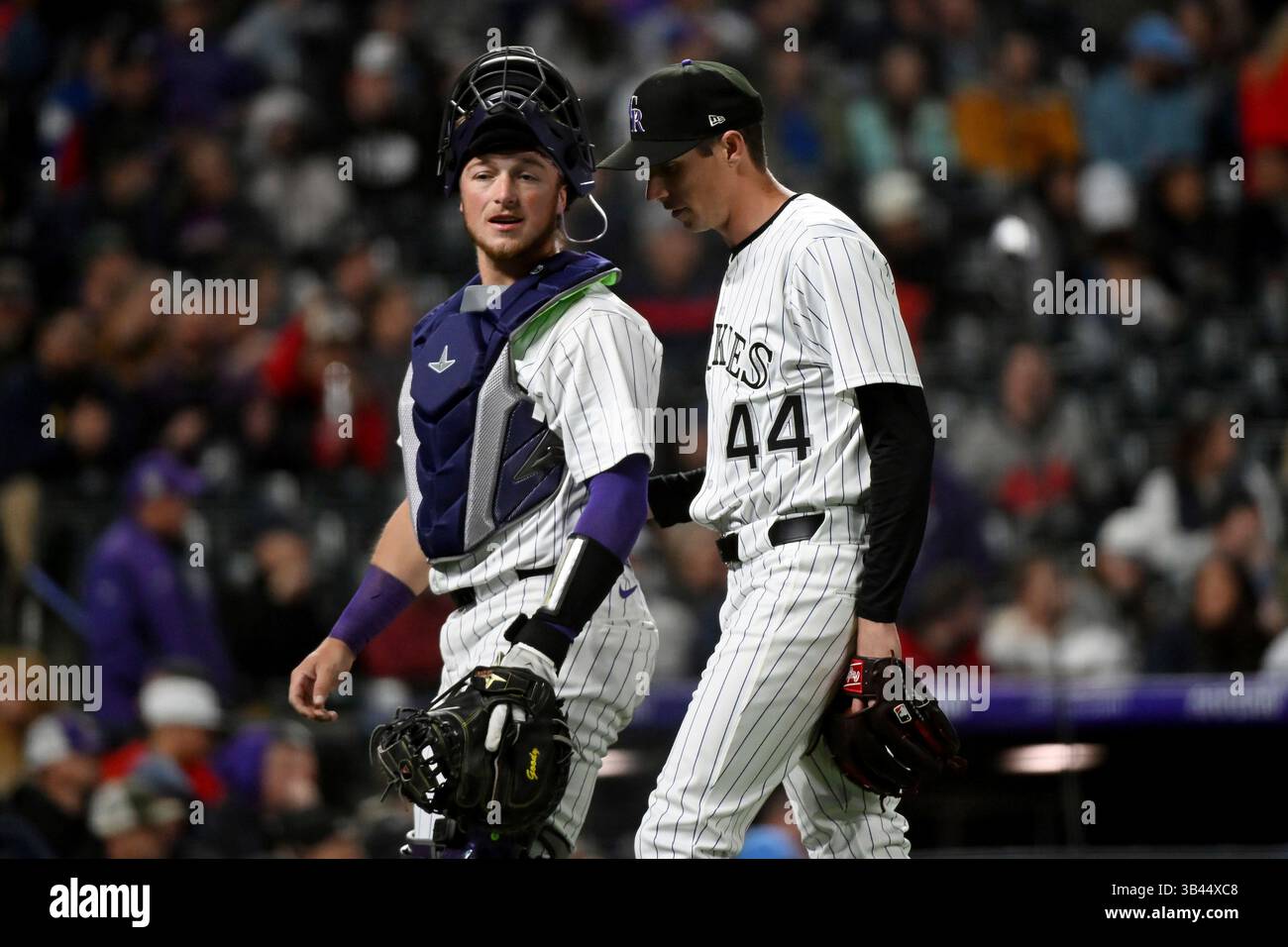 Colorado Rockies catcher Hunter Goodman (15) and relief pitcher Jimmy ...