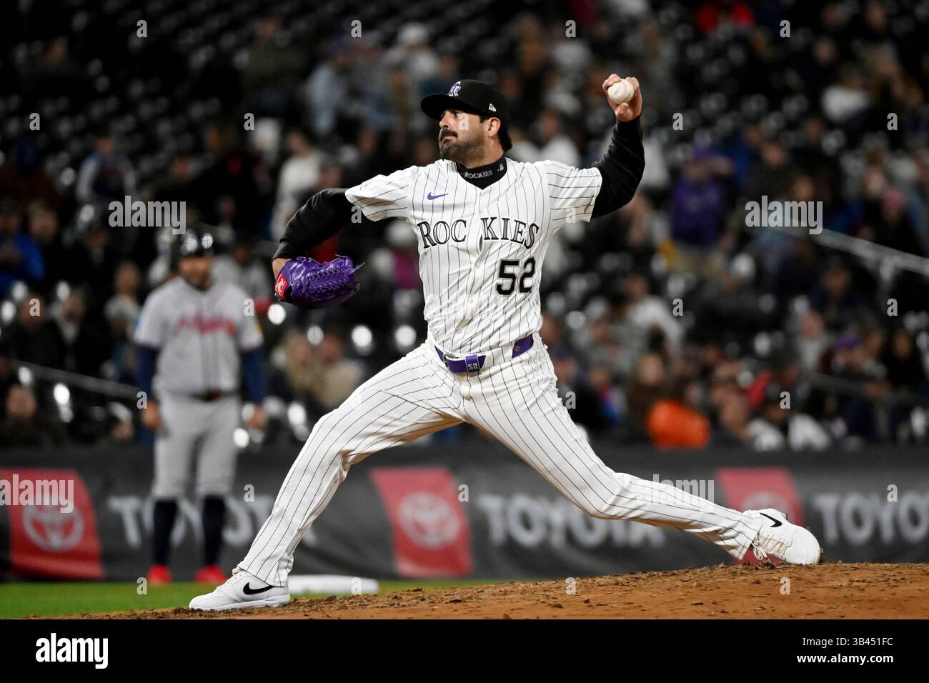 Colorado Rockies relief pitcher Scott Alexander (52) delivers a pitch ...