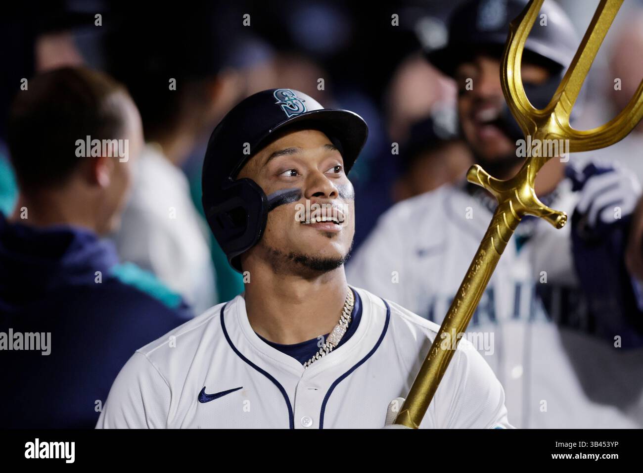 Seattle Mariners' Jorge Polanco is congratulated in the dugout on his ...