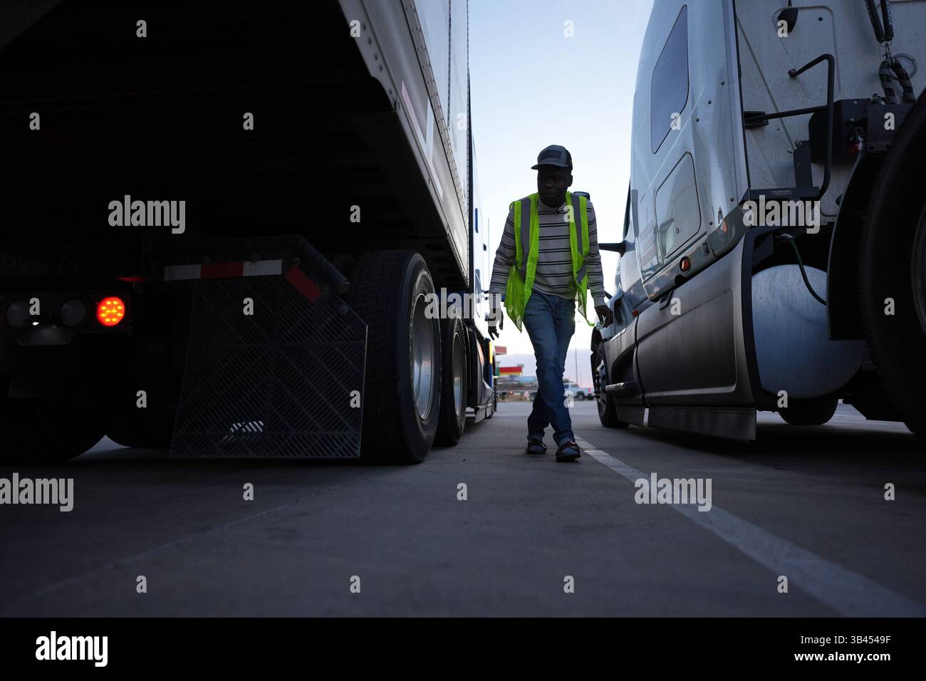Haitian immigrant Kevenson Jean, a truck driver, checks his truck ...