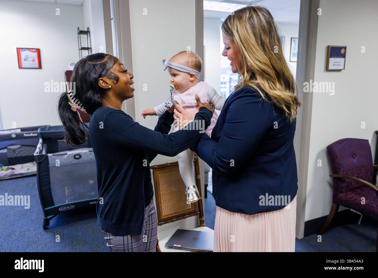 Florida Rep. Fiona McFarland, R-Sarasota, right, hands 7-month-old ...