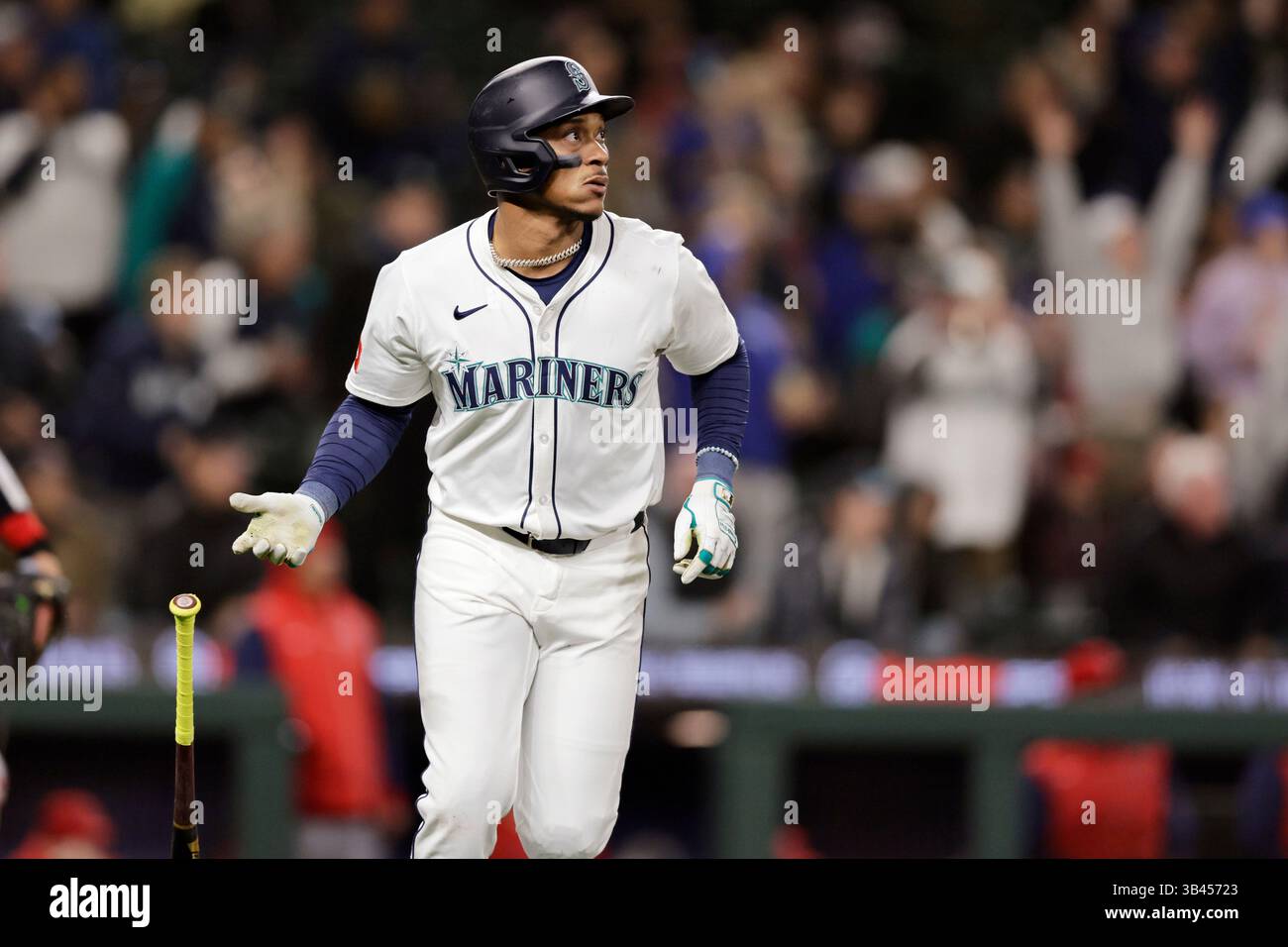 Seattle Mariners' Jorge Polanco drops his bat after hitting a two-run ...