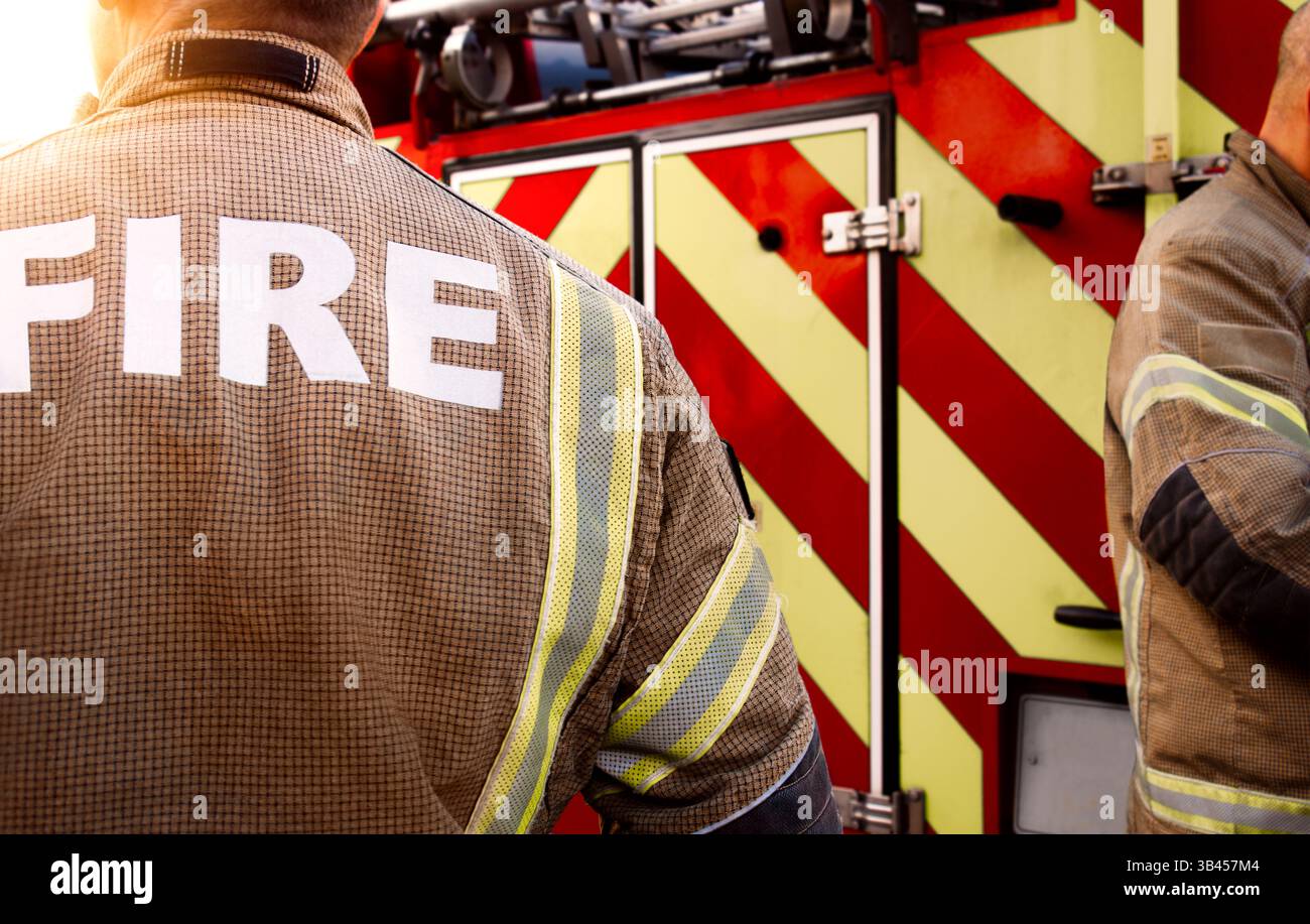 Firefighter team - firemen equipped with emergency services response ...