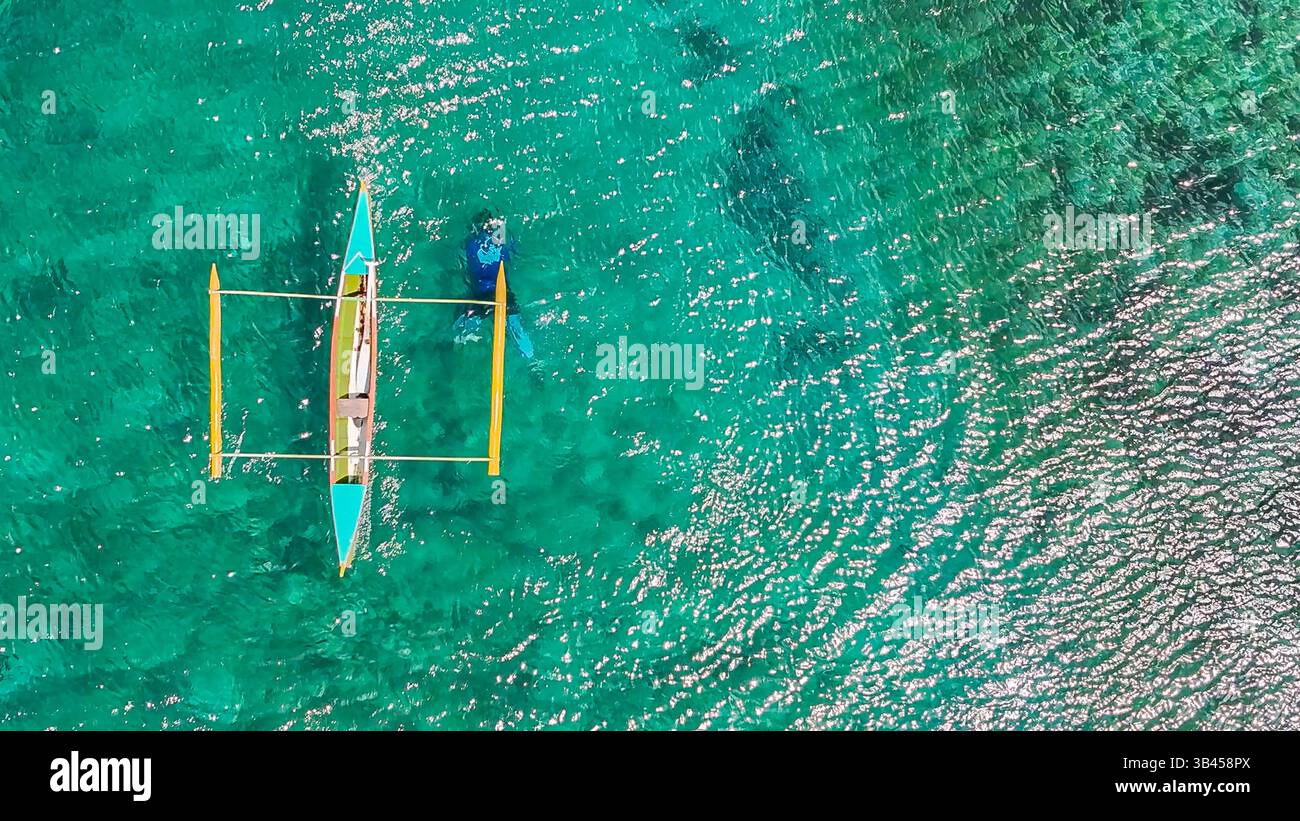 Surigao Philippines, A young man free dives for sea urchins with his ...