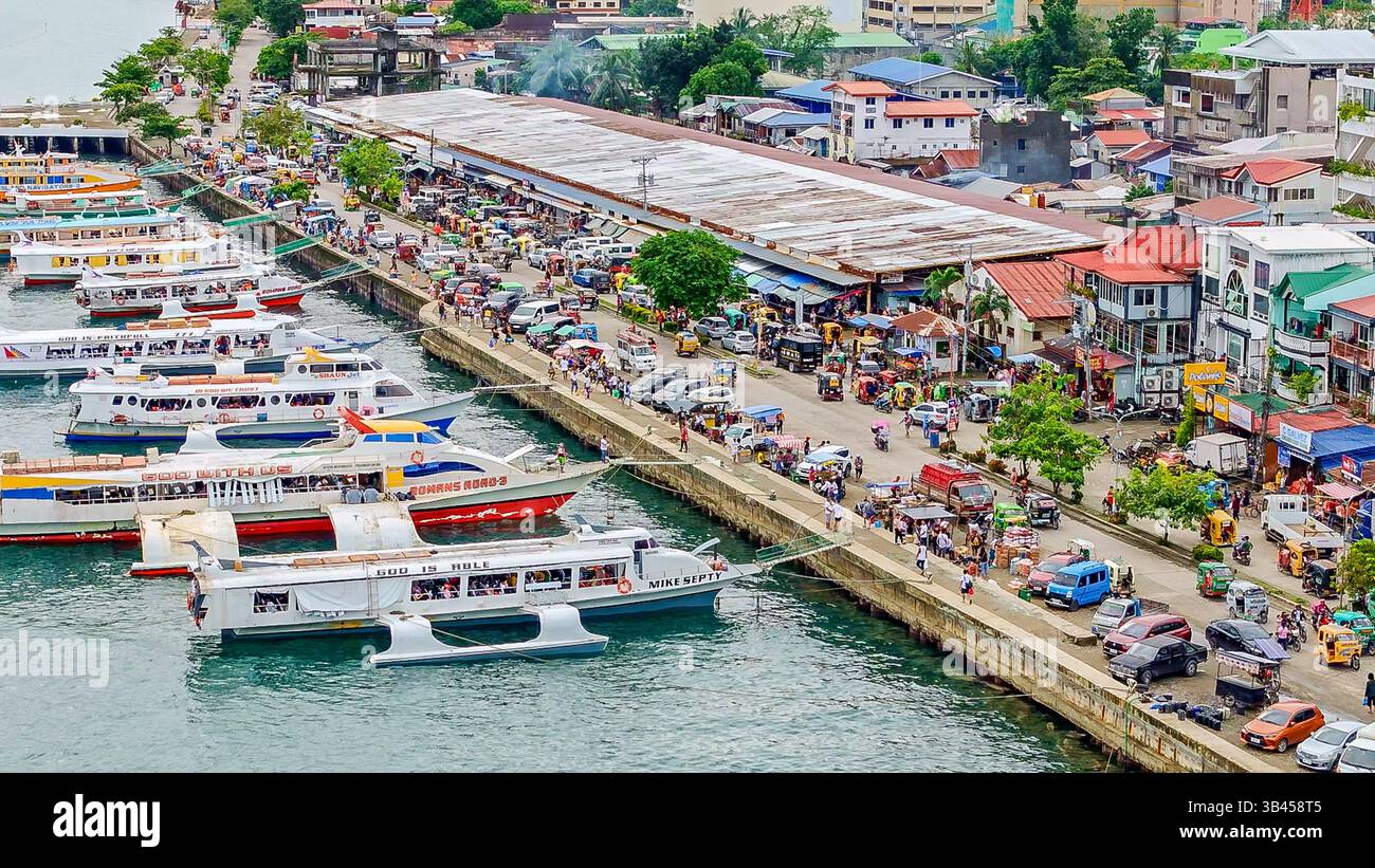 Surigao City Boulevard Morning Ferry Commute Stock Photo - Alamy