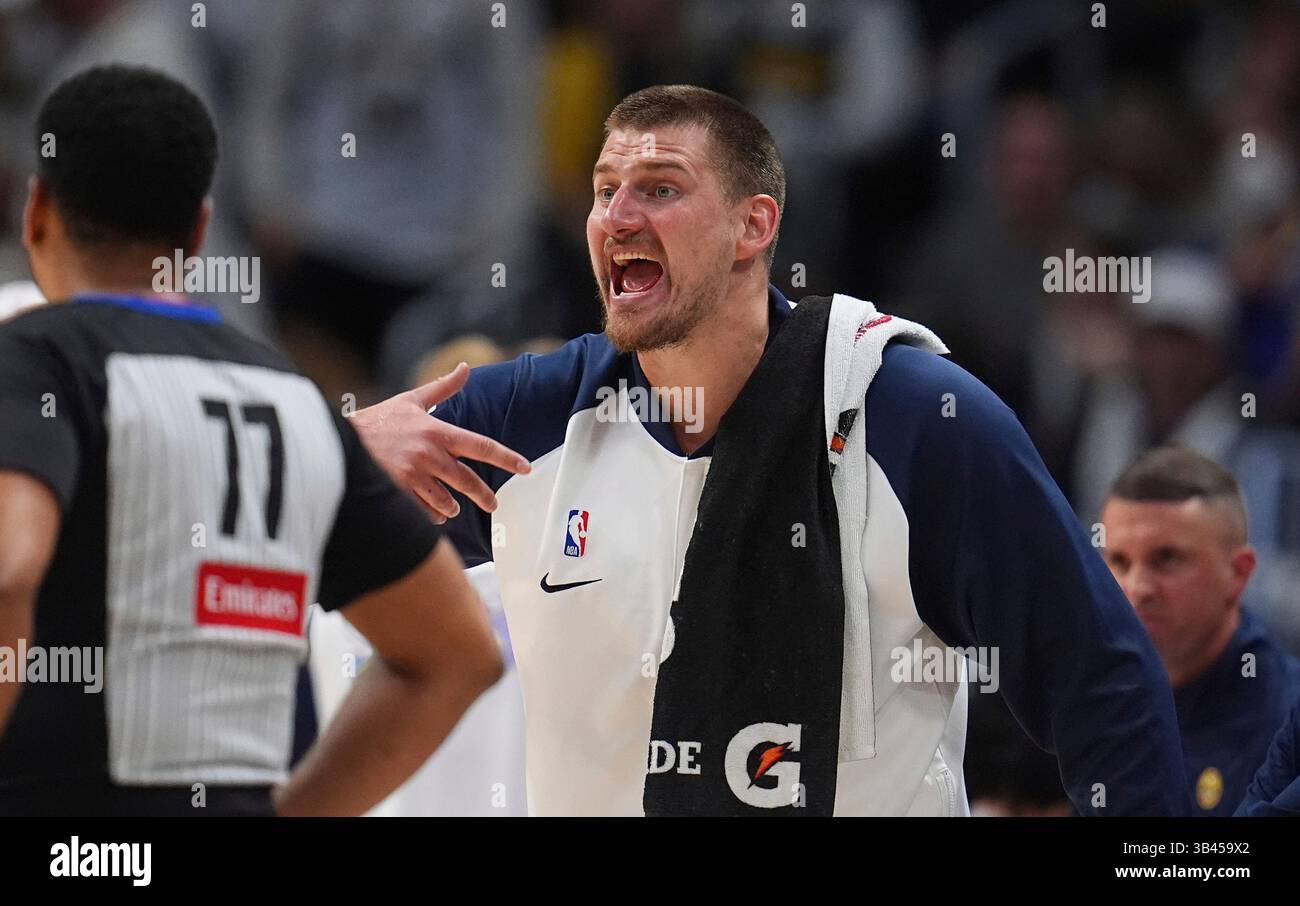 Denver Nuggets center Nikola Jokic yells to teammates from the bench in ...