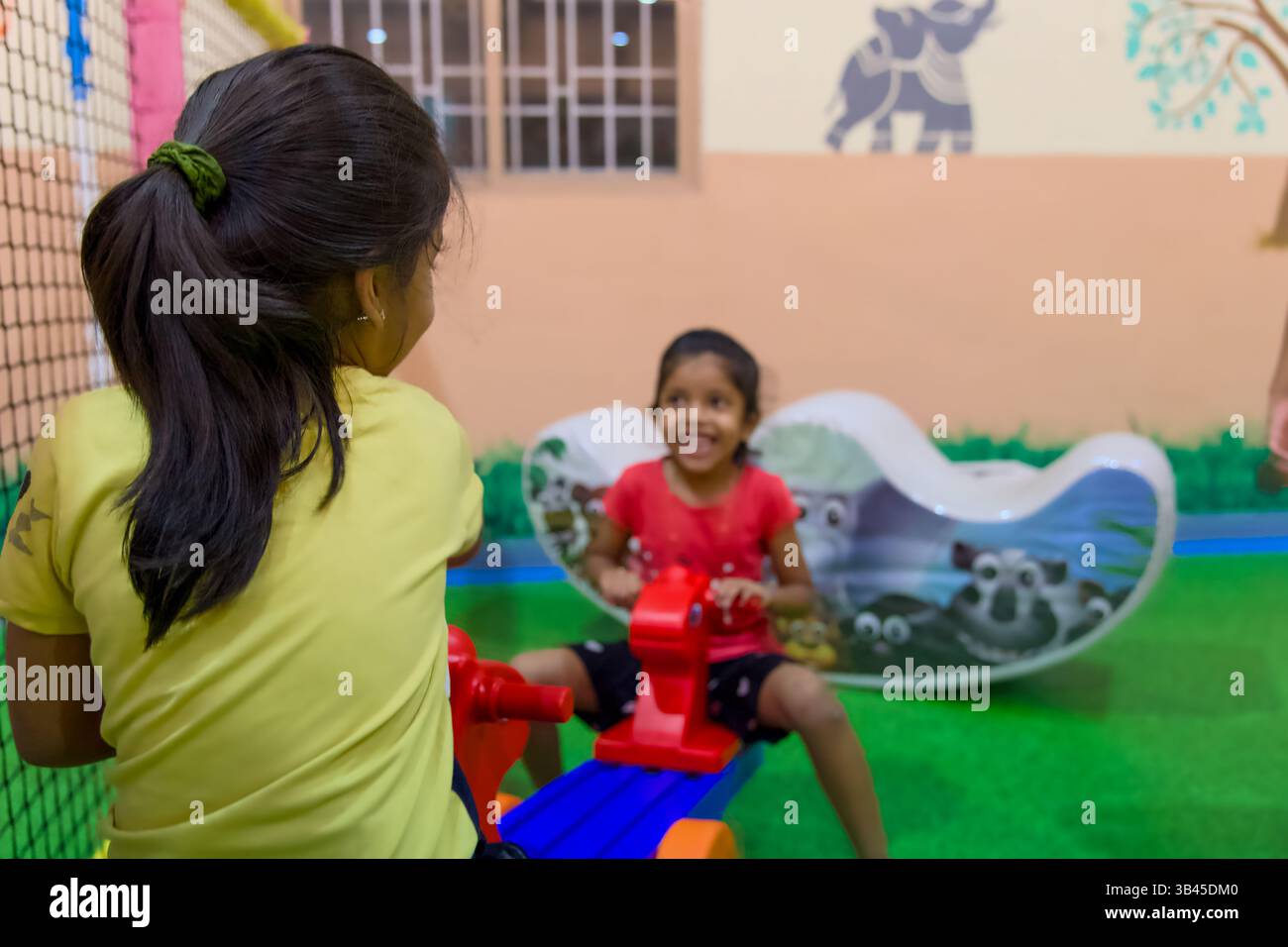 Two children engage in playful hi-res stock photography and images - Alamy