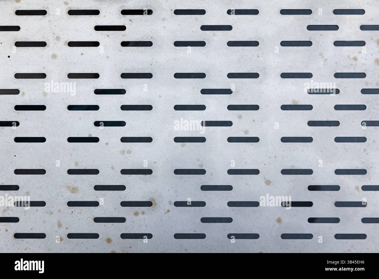 Steel industrial flooring. Steel deck with holes on the deck of the ...