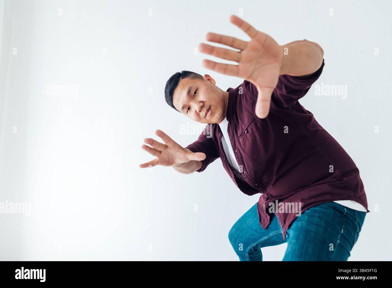 Cheerful asian man enjoys hi-res stock photography and images - Alamy