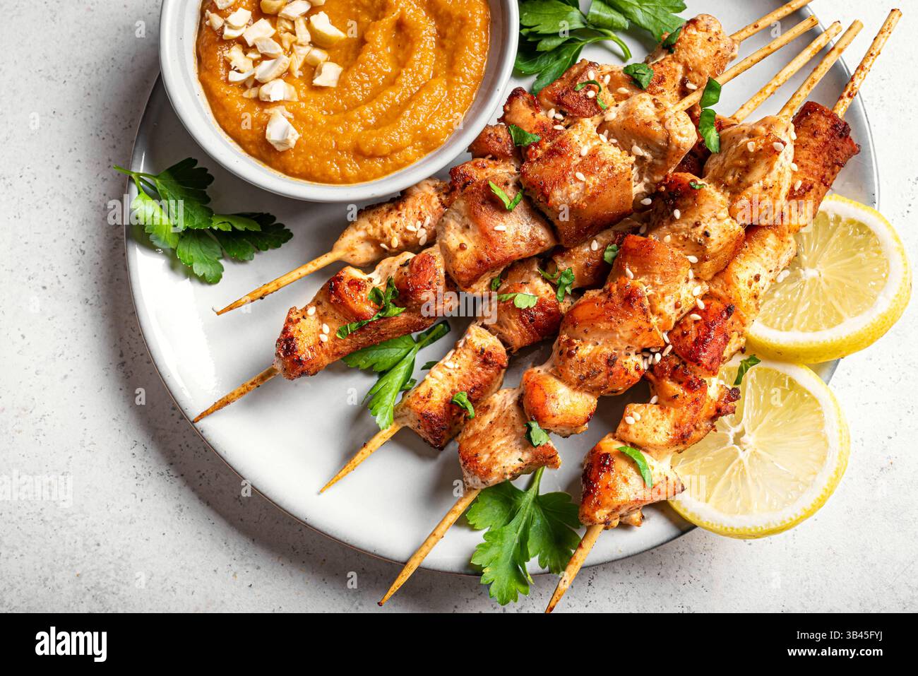 Grilled chicken satay skewers with spicy peanut sauce. Sate ayam. Thai ...