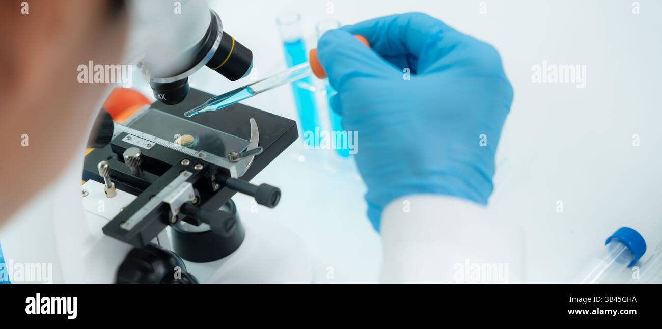 Scientist analyze biochemical samples in advanced scientific laboratory ...