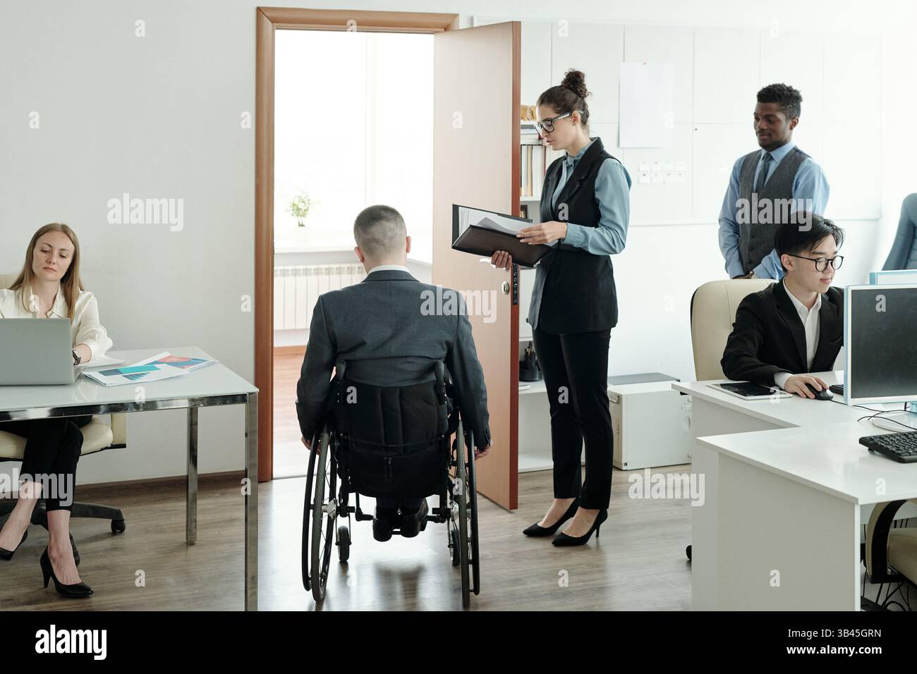 Handicapped person entering office hi-res stock photography and images ...