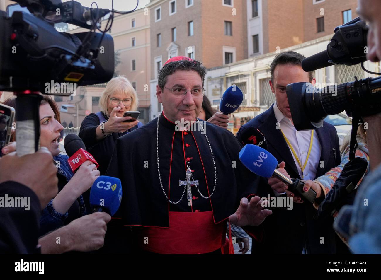 Canadian Cardinal Francis Leo is approached by reporters as he arrives ...