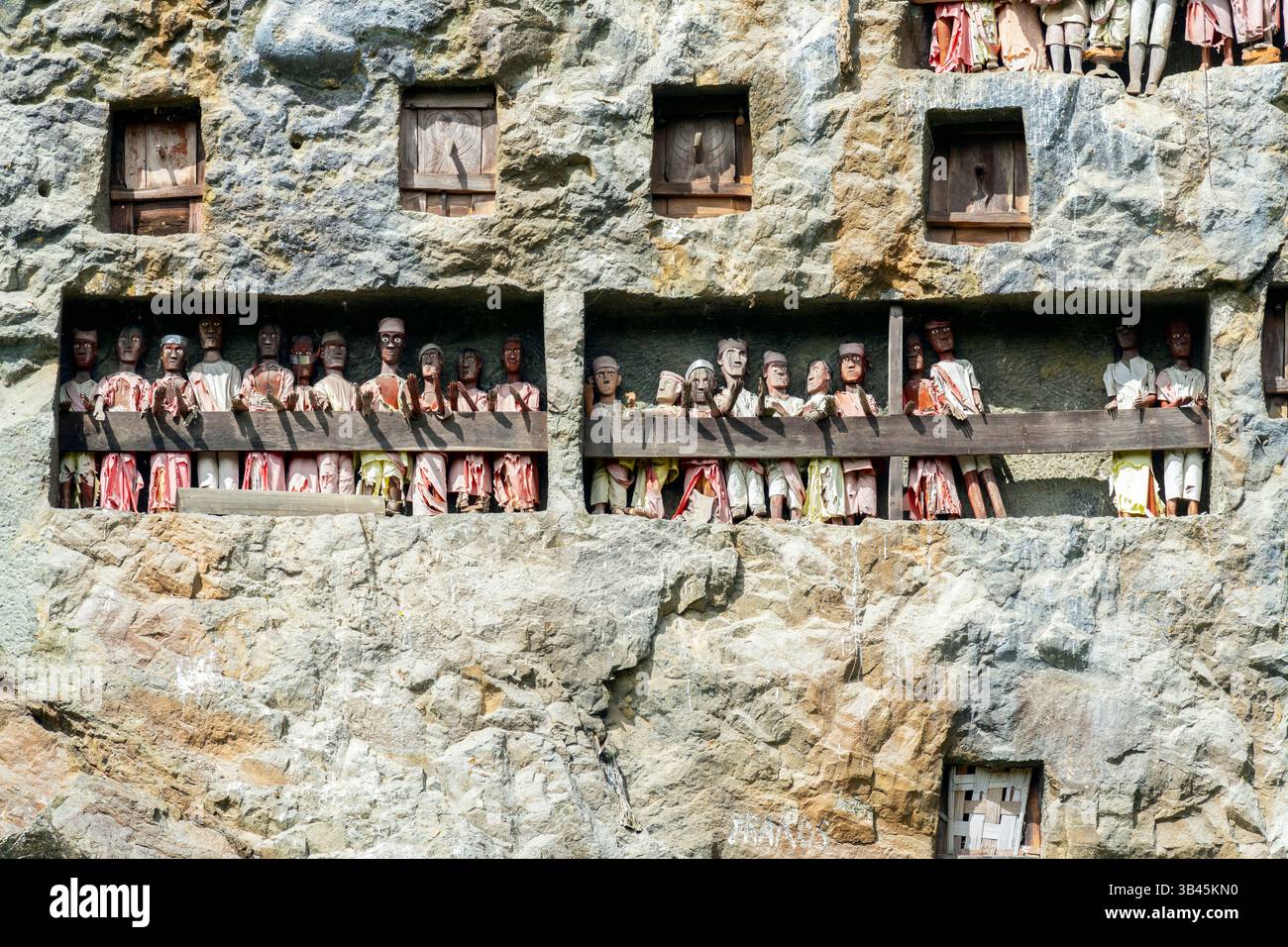 Spectacular Life-size wooden effigies or tau tau of the deceased are ...