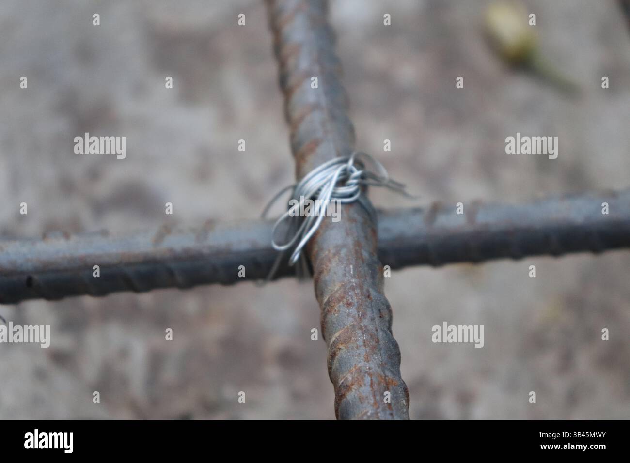 Steel reinforcing bars fastened with wire, creating a grid ...