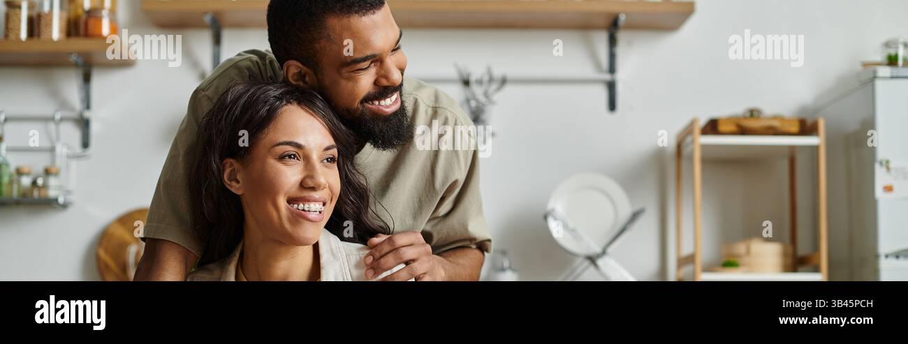 Loving couple shares a warm, intimate moment in their kitchen ...