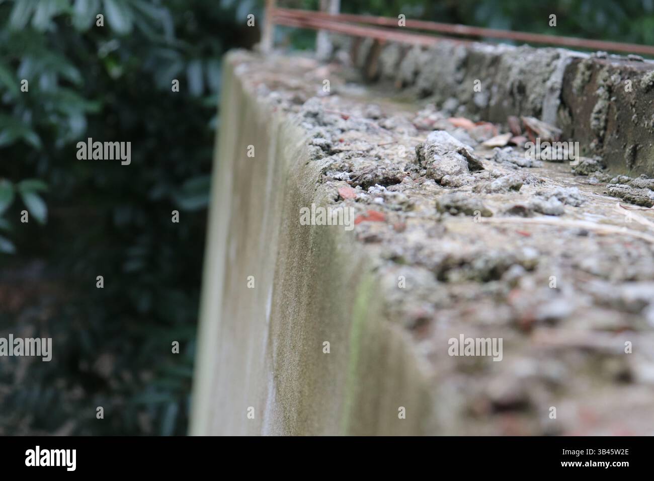 Close-up showcases a weathered cement wall, revealing aged texture with ...